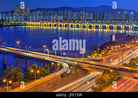 Jamsil bridge over Han River against Seoul Skyline at night. In the ...