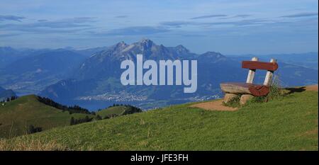 Bench on top of mount Rigi and distant view of mount Pilatus Stock ...