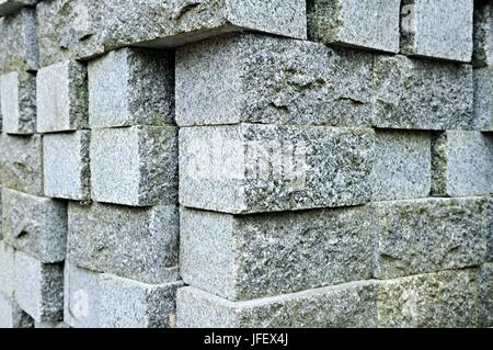 Layered granite facing bricks Stock Photo - Alamy