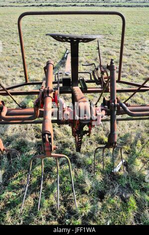 Old rusty Hay Turner. Old agricultural equipment on hay Stock Photo - Alamy