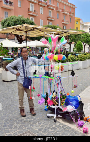 Vendor selling toys in a street market, New Delhi, India Stock Photo ...