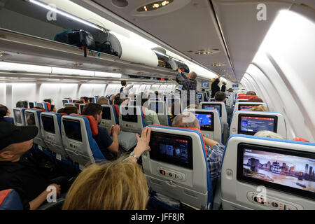 Entertainment system screens inside the cabin of a Emirates Boeing 777 ...