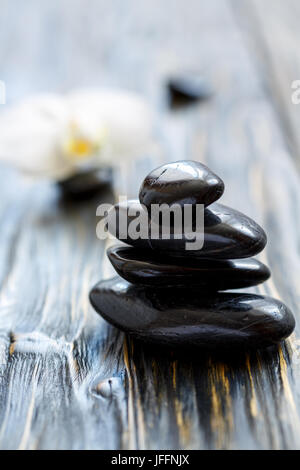 basalt stones for hot stone massage with accessories on wooden ...