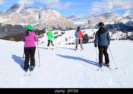 Teenager child girl in winter hat with shopping bags on yellow ...