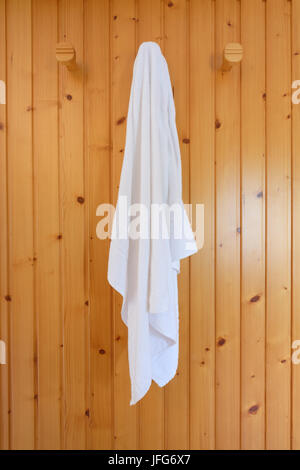 Clean towel hanging on a drying rack in a bathroom. The image ...