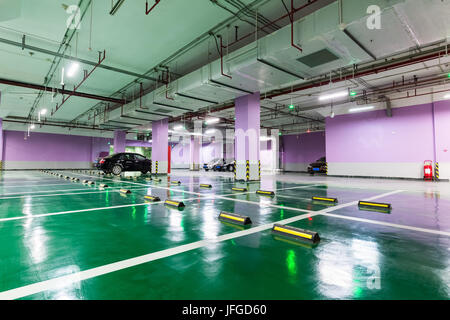 Empty underground car parking lot. Underground car parking garage at ...