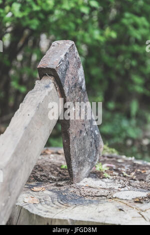 Old axe on a chopping block Stock Photo - Alamy