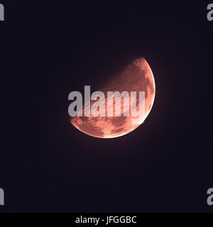 2d illustration of a red moon rising over the ocean Stock Photo - Alamy