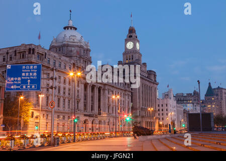 Illuminated historic buildings at the Bund street in Shanghai, China ...