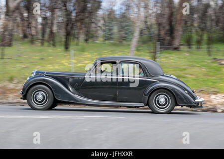 Vintage 1950 Riley RMB Sedan driving on country roads near the town of ...