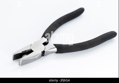 Close up macro of metal pliers with blue handle Stock Photo - Alamy