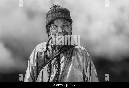 Portrait of man from the indigenous Monpa tribe with hat and ...