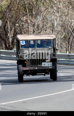 Old vintage Willys jeep driving in the city center. Cuba is known for ...
