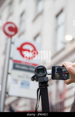 Metropolitan Police Forward Intelligence Team evidence gatherer films ...