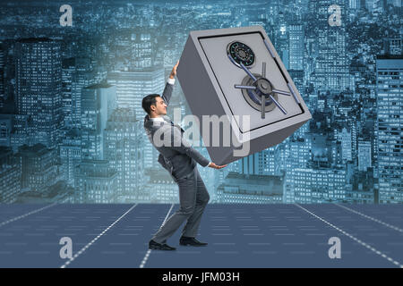 Businessman carrying metal safe in security concept Stock Photo - Alamy