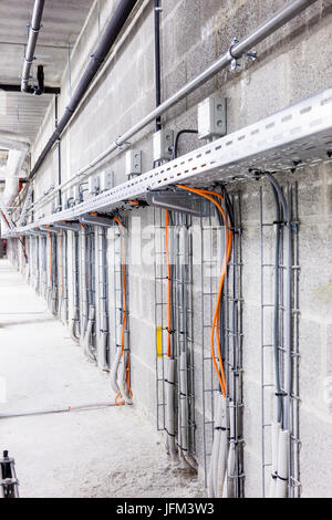 Electrical cables are located in a cableway on the roof of a building ...