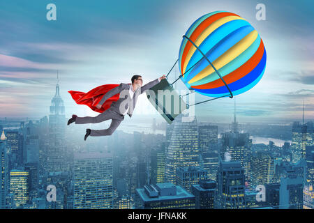 Businessman flying on balloon in challenge concept Stock Photo - Alamy