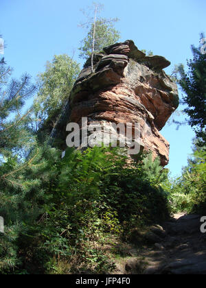 Photograph of a prominent rock formation, capturing its geological ...