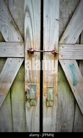 rustic barn door with locks Stock Photo - Alamy