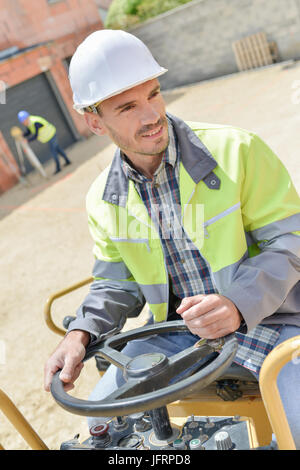 Portrait of tractor operator at workplace Stock Photo - Alamy