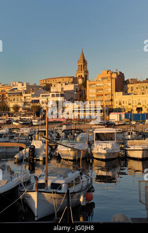 Sunset at the fishing port and village of Palamos, Girona, Catalonia ...