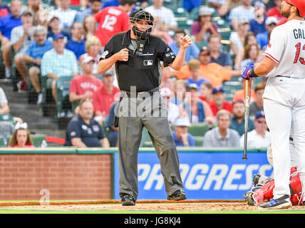 MLB home plate umpire Chad Fairchild signals a strike during an MLB ...