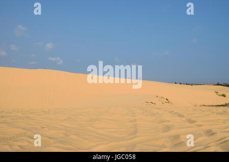 Vietnam, Mui Ne, Sand Dunes, Tourist sliding on sand dune Stock Photo ...