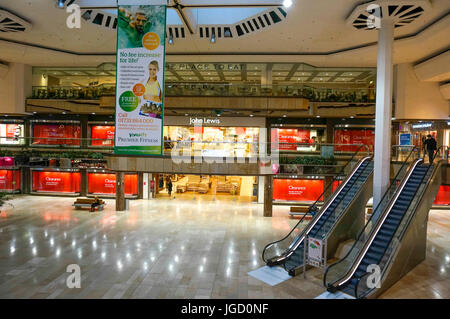 Inside a quiet Queensgate Shopping Centre, with people on the ground ...