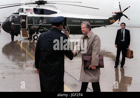 President Jimmy Carter shakes hands with a U.S. Air Force officer upon ...