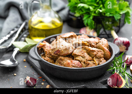 roasted pork and innards with chicken liver stab in wooden stick on ...