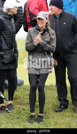 Rory McIlroy, of Northern Ireland, with his wife Erica Stoll, kisses ...