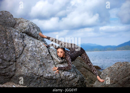 Hainan, China. 6th July, 2017. Chinese contortionist Liu Teng performs ...