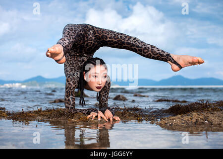 Hainan, China. 6th July, 2017. Chinese contortionist Liu Teng performs ...