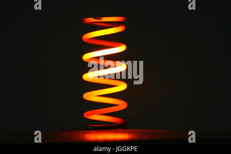 Red hot glowing steel spring Stock Photo - Alamy