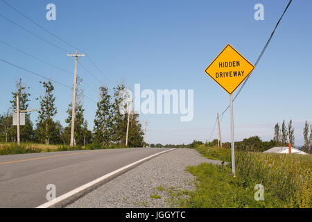 A hidden driveway road sign Stock Photo - Alamy