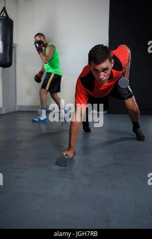 Determined male boxers practicing in health club Stock Photo - Alamy