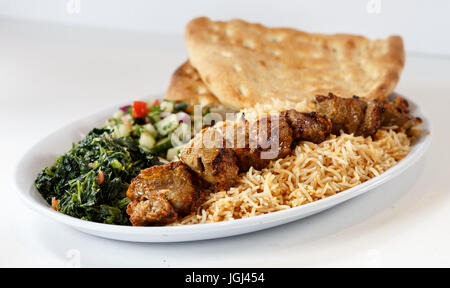 kabob dinner w/ rice and sides Stock Photo - Alamy