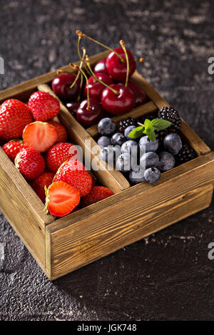 ripe strawberry berries dark wooden background. space text Stock Photo ...