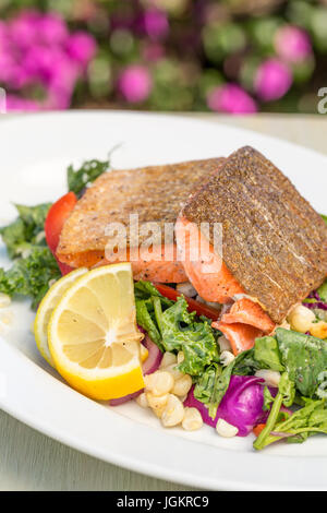 Roasted cabbage steaks on plate over white background. Top view, flat ...