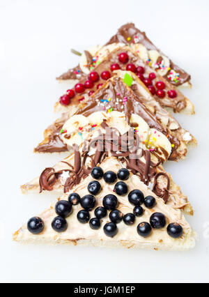 Sweet triangle sandwiches with fruit and cream Stock Photo - Alamy