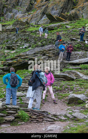 people climbing skellig michael rock skelligs isle Stock Photo - Alamy