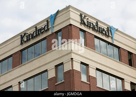 A logo sign outside of the headquarters of Kindred Healthcare in ...