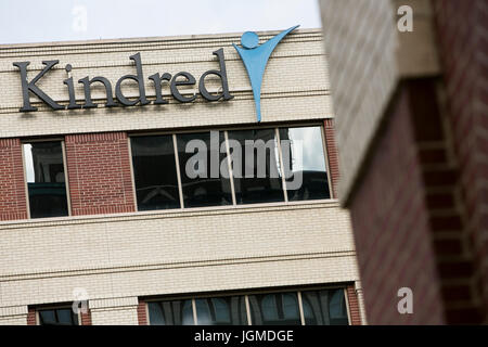 A logo sign outside of the headquarters of Kindred Healthcare in ...