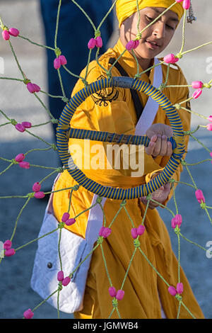 Chakar or Gatka Chakar looks like a wagon wheel with weights at the end ...