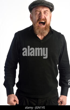 Stylish fashion model screaming while posing in studio dressed casually ...