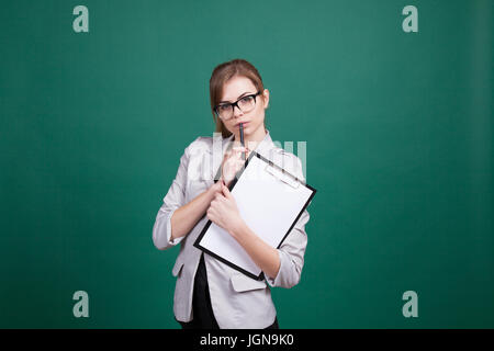 teacher with papers in green boards bussines Stock Photo - Alamy
