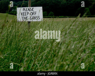 A sign on a grass field Stock Photo - Alamy