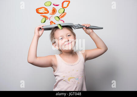 funny girl with a frying pan Stock Photo - Alamy