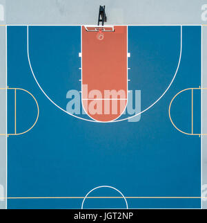 Half Green basketball playground with white markings and morning ...