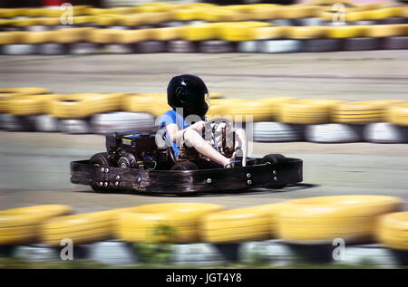 Karting - driver in helmet on kart circuit Stock Photo - Alamy